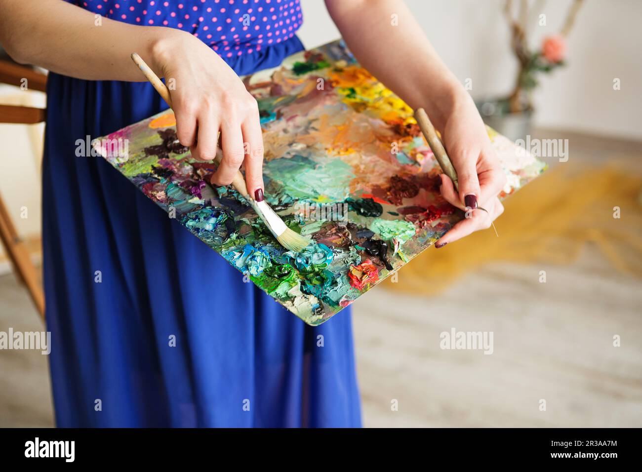 Artists brushes and oil paints on wooden palette. macro artist's palette, texture mixed oil ...