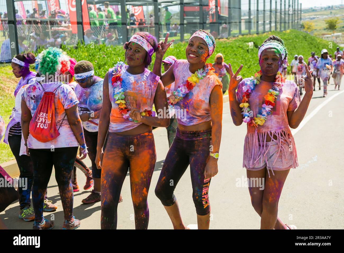 Diverse people running in The Color Run Marathon in Soweto Stock Photo ...