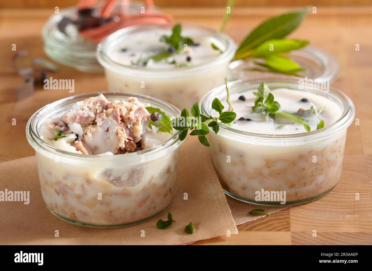Pork rillettes canned in mason jars with fresh herbs Stock Photo - Alamy
