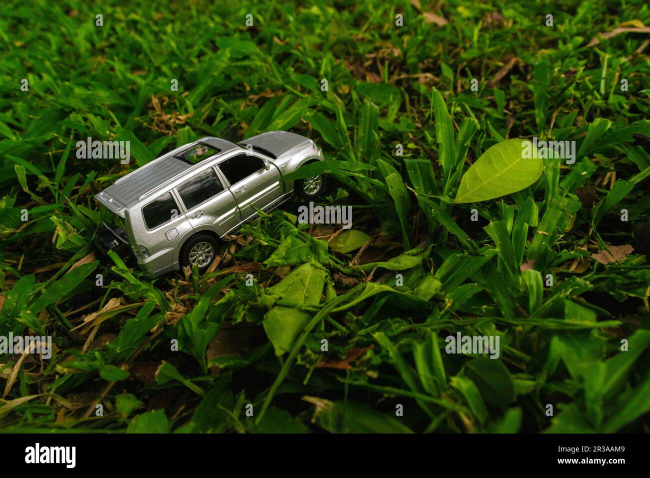Concept for travelling with a car. Photo of a toy car placed in the ...
