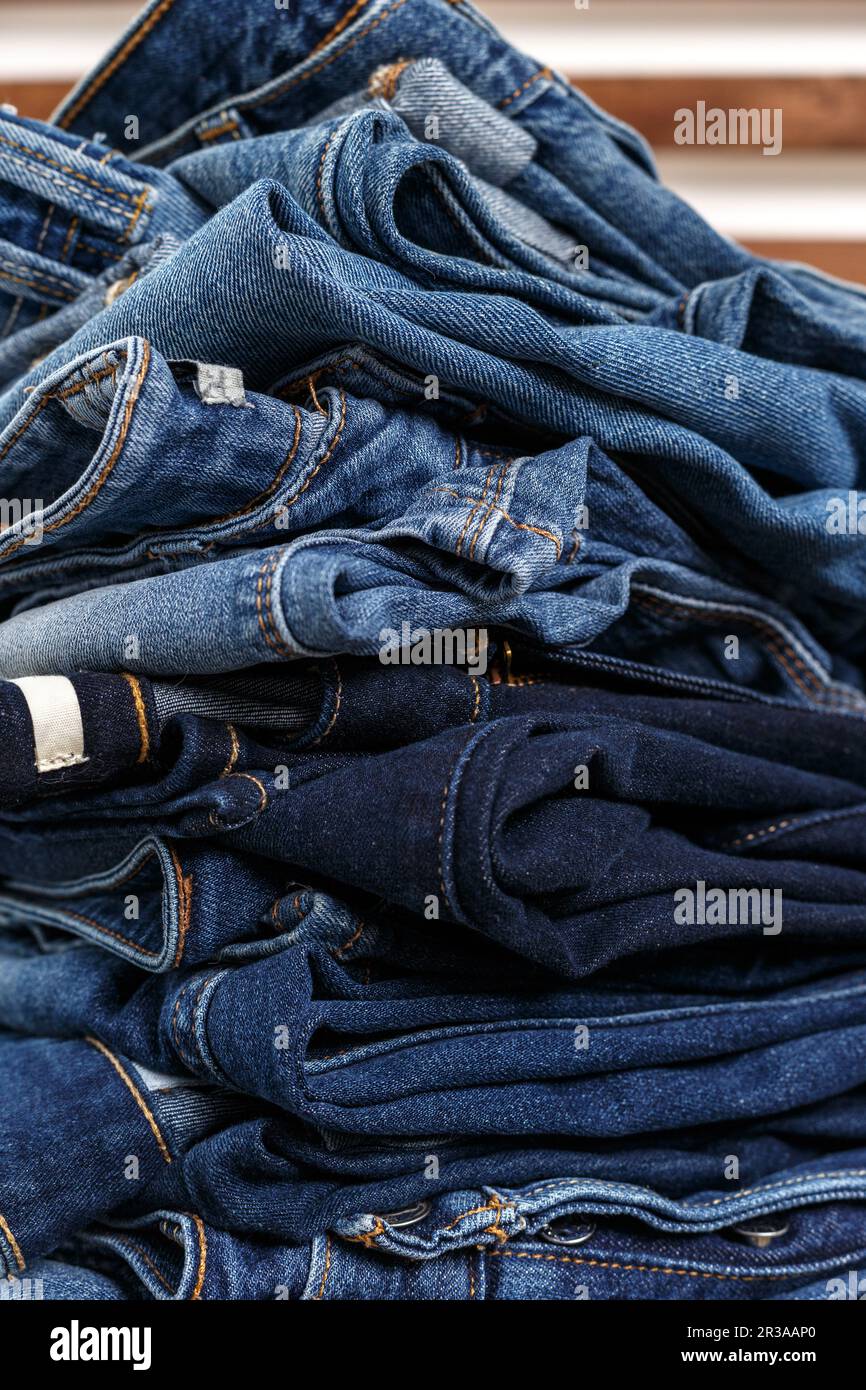 Pile of jeans Stock Photo - Alamy