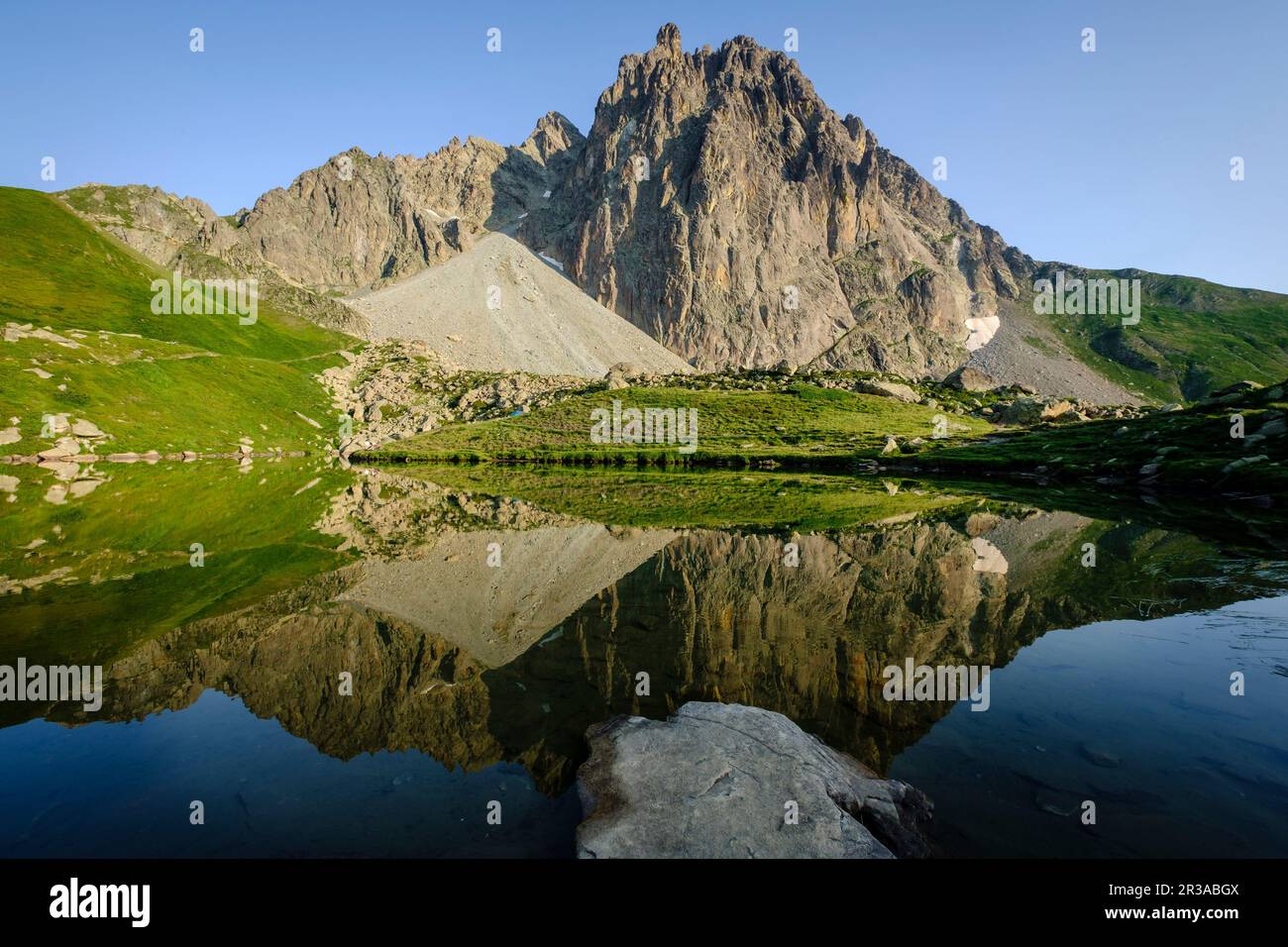 Midi d'Ossau peak, 2884 meters, and Pombie lake, Pyrenees National Park ...
