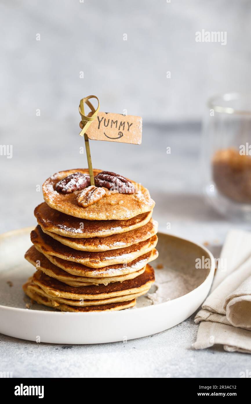 Homemade classic american pancakes with pecans and maple syrup, served ...