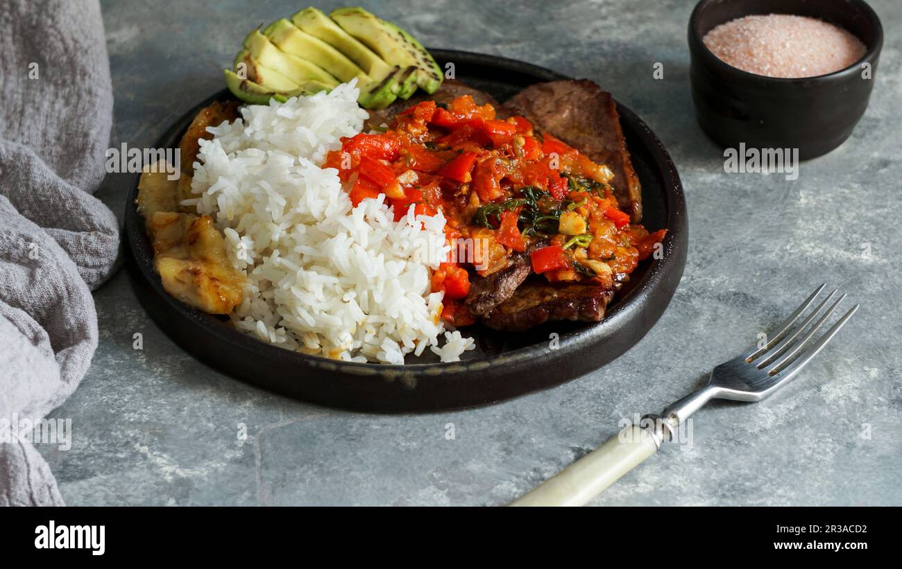 El Bistec a la Criolla - colombian beef steak with tomatoes sauce, rice ...