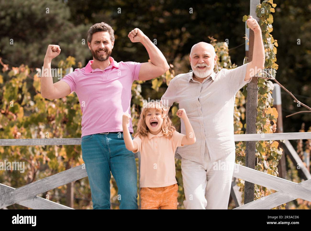 Multi generation family. Excited grandfather father and son outdoors ...