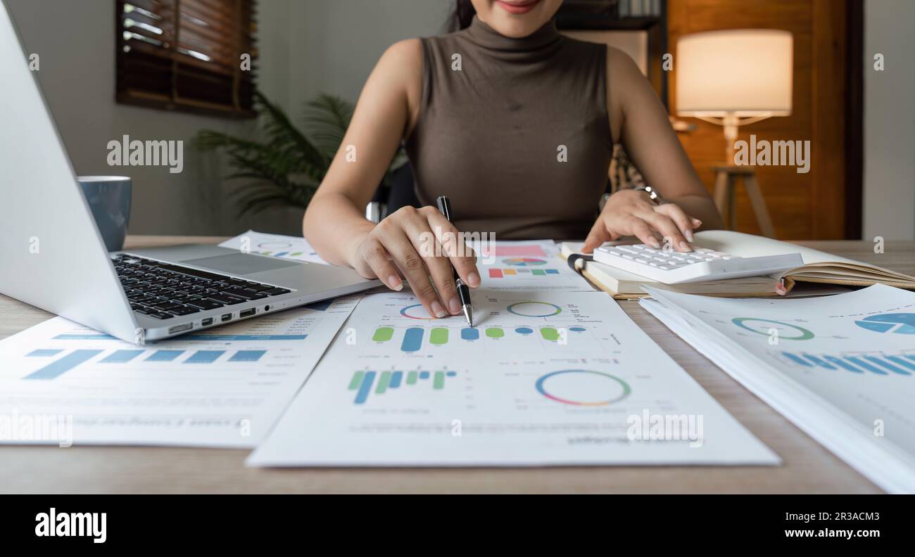 business woman or accountant who are using a calculator to calculate business data Accounting ...