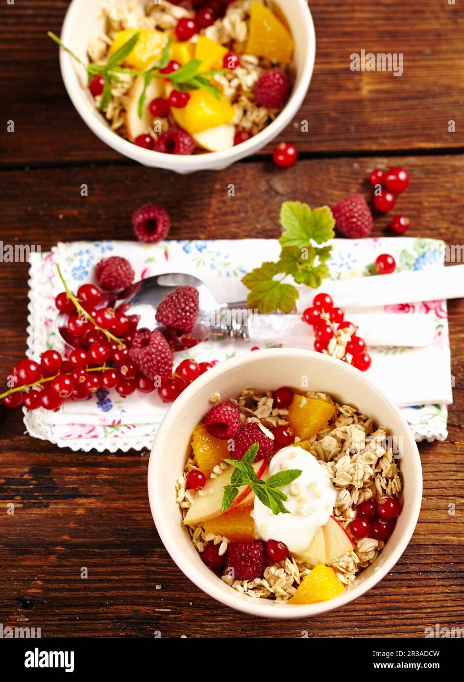 Bircher muesli with oats, fresh berries, apples, orange, milk, honey ...
