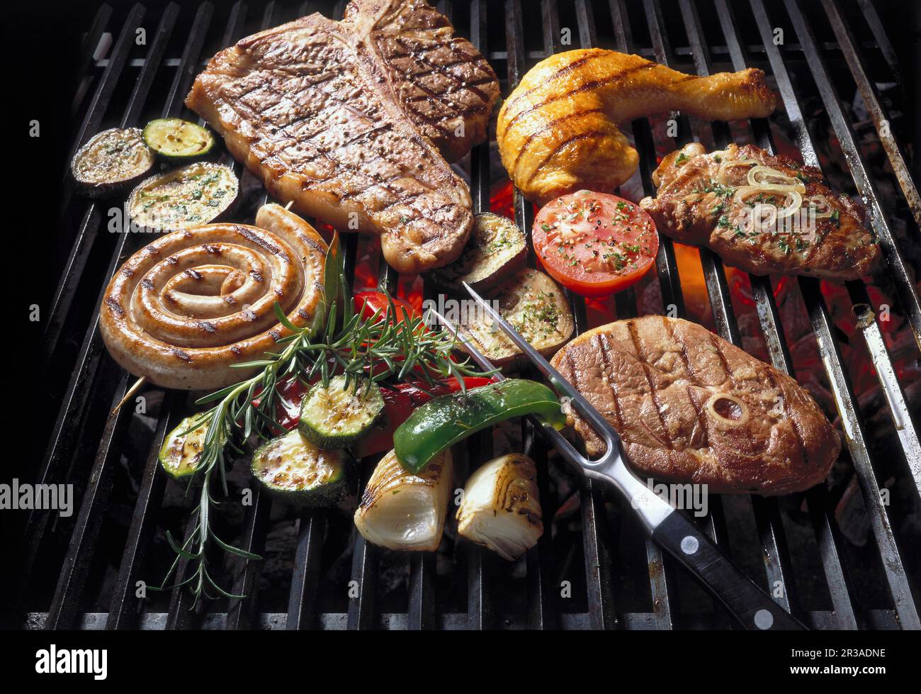 Meat, poultry and vegetables on a grill grate Stock Photo - Alamy
