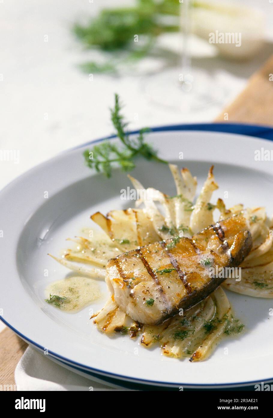Grilled fish fillet on fennel slices Stock Photo - Alamy