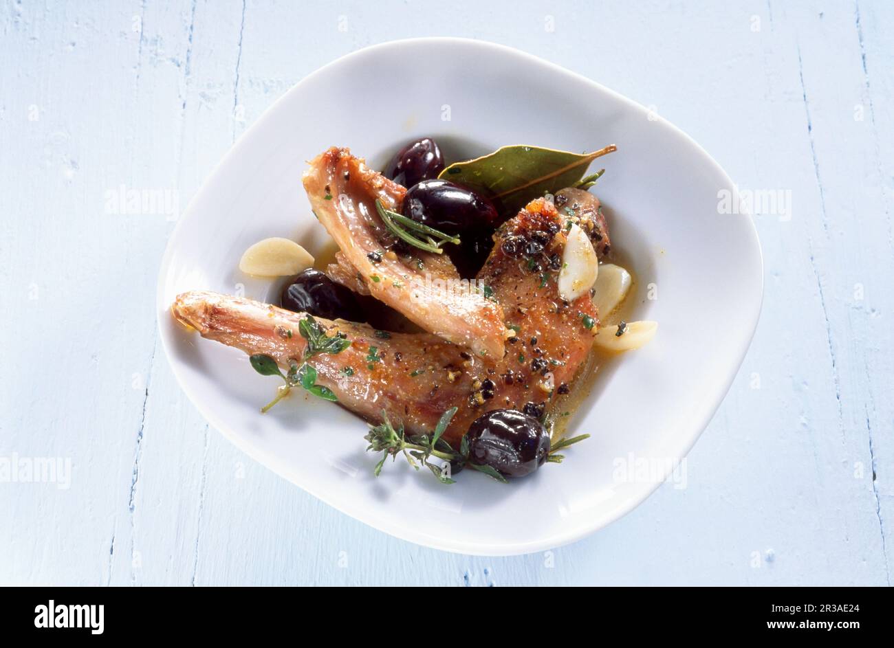 Marinated braised rabbit with black olives (Spain Stock Photo - Alamy