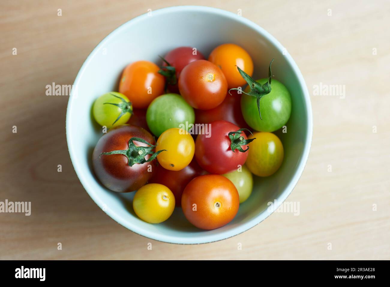 Colourful tomatoes in small bowls Stock Photo - Alamy