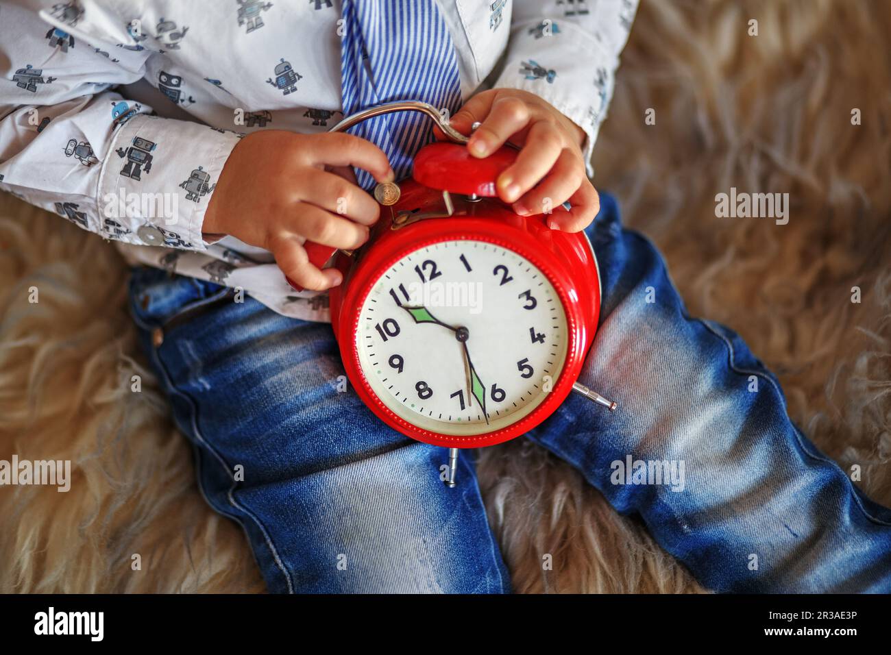 Boy holding clock hi-res stock photography and images - Alamy