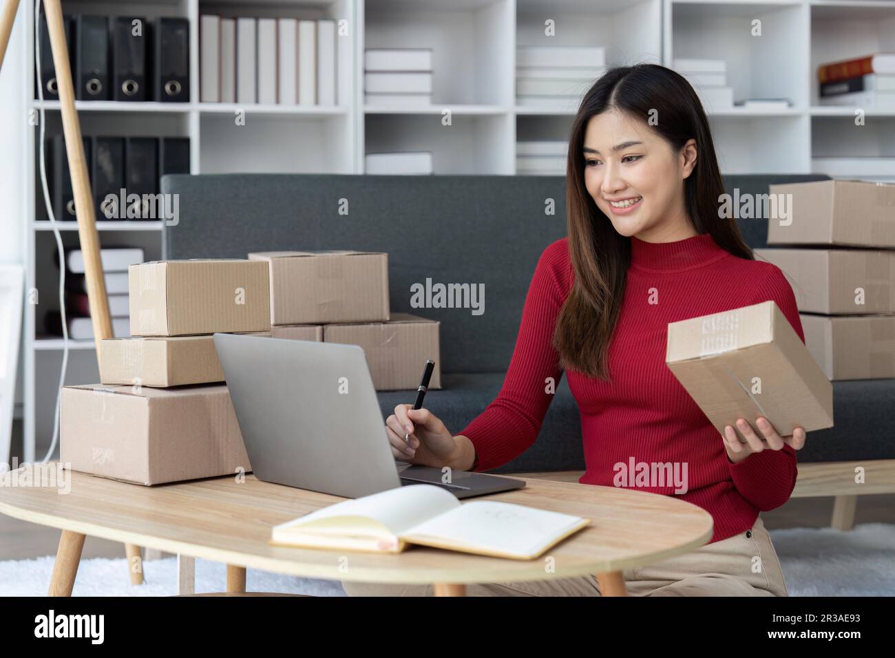 SME online business ideas small business startup a asian female entrepreneur uses a laptop ...