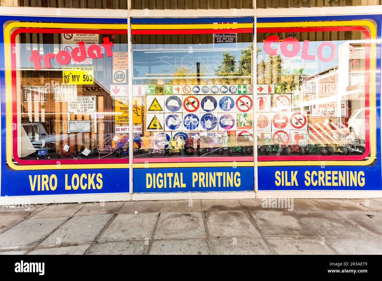 Front entrance to a Locksmith and number plate making shop Stock Photo ...