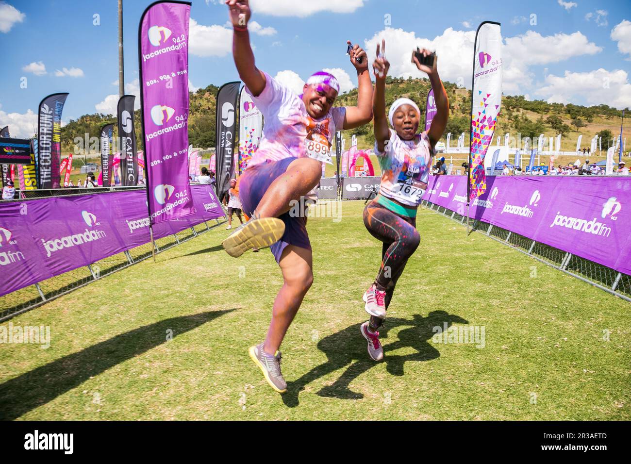 Diverse people running in The Color Run Marathon in Soweto Stock Photo ...