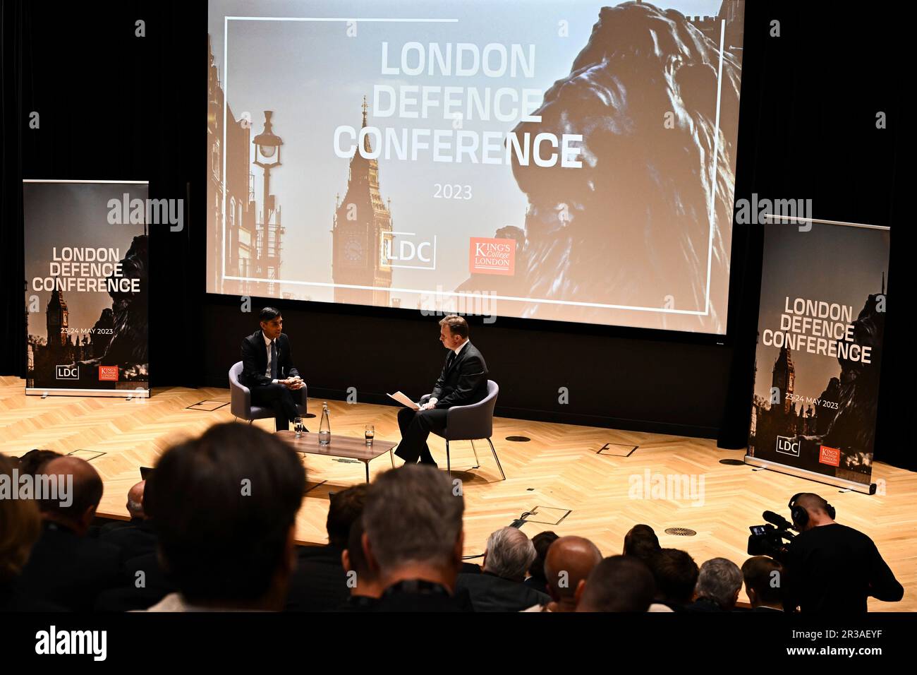 Britain's Prime Minister Rishi Sunak, left, speaks with Director of the ...