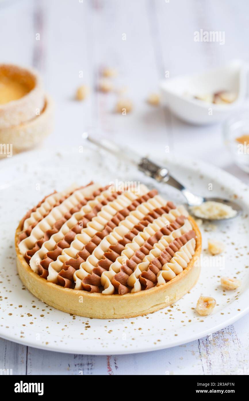 Delicious mini tarts with nuts and custard. Assortment of delicious and ...