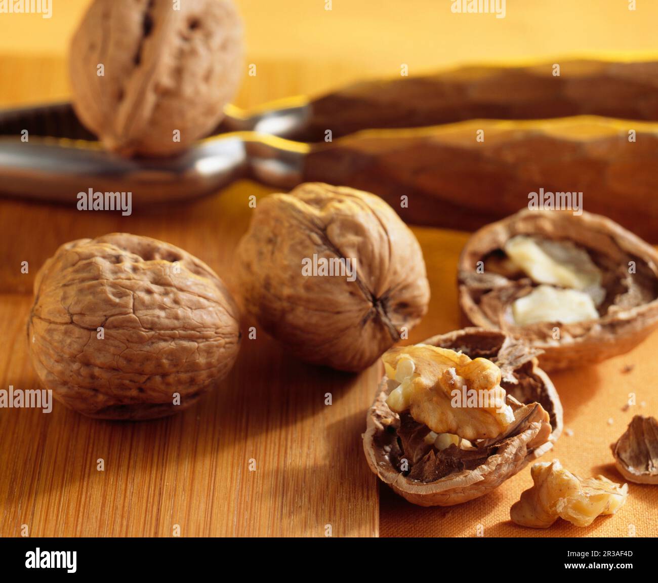 Walnuts (Juglans regia), whole and opened, with a nutcracker Stock ...
