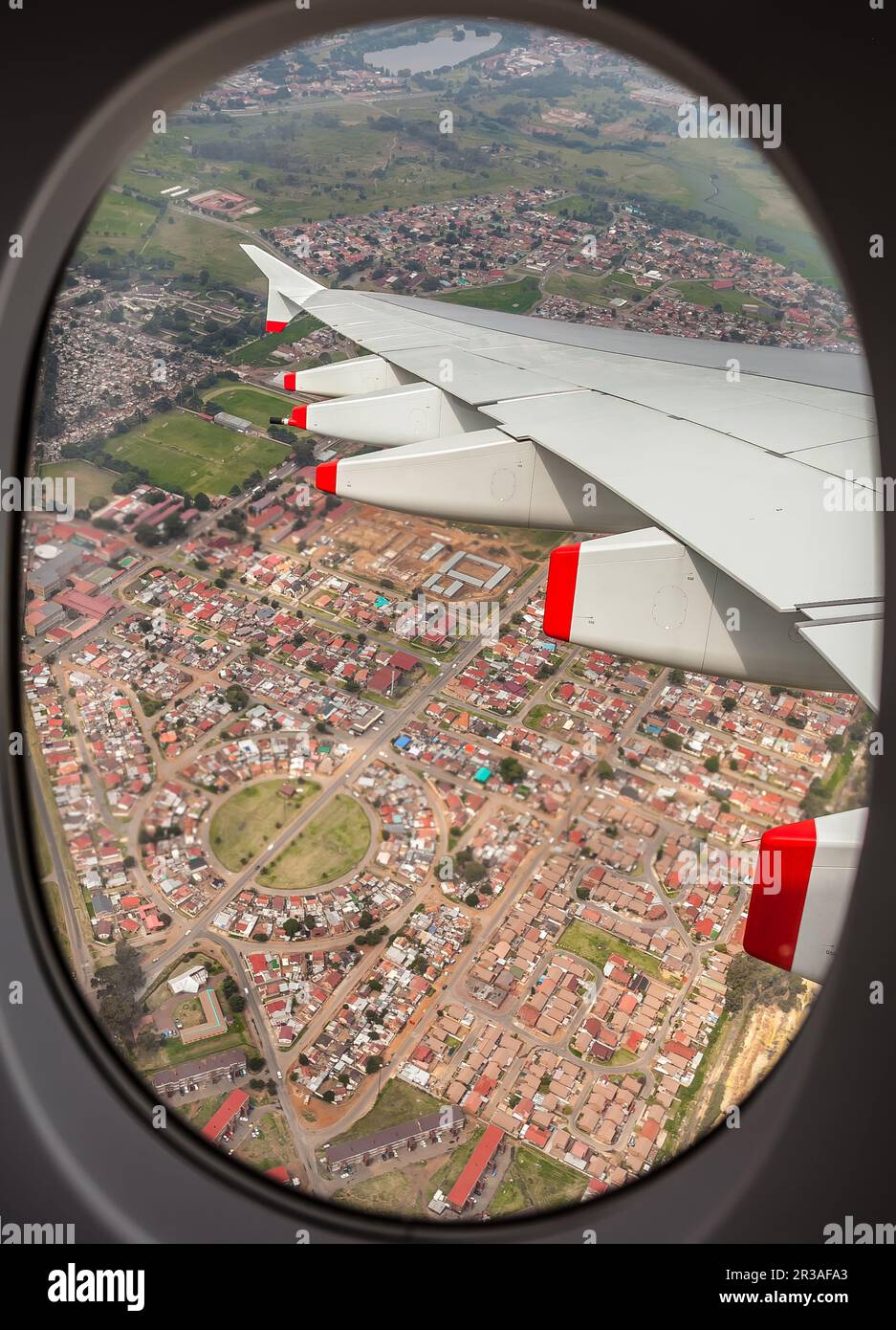 View of an airplane wing out the window Stock Photo - Alamy