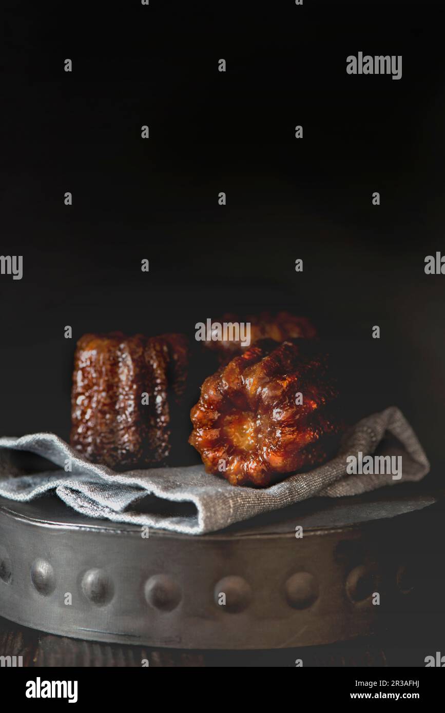 Three French Canelés cakes from Bordeaux Stock Photo - Alamy