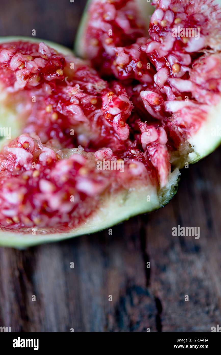 A close up of a torn open purple fig Stock Photo - Alamy