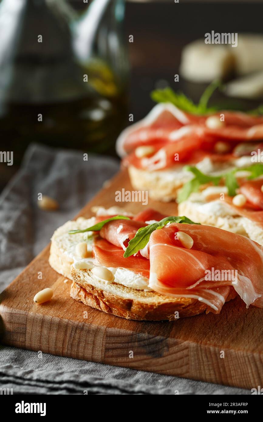 Traditional parma cured ham antipasto. Bruschetta set with Parma Ham ...