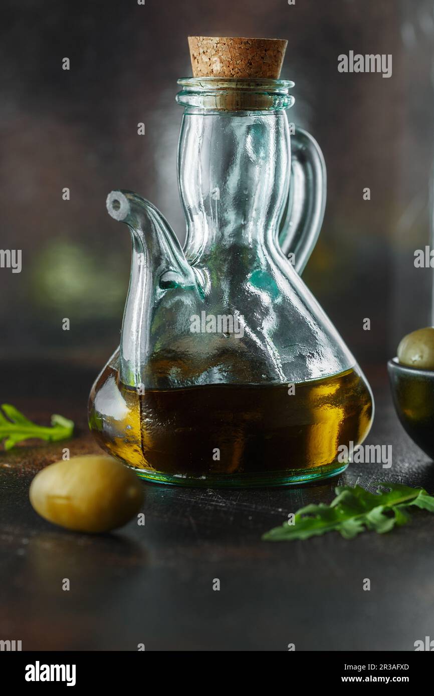 Fresh Organic Olive Oil in the jug on dark background. Food photography ...