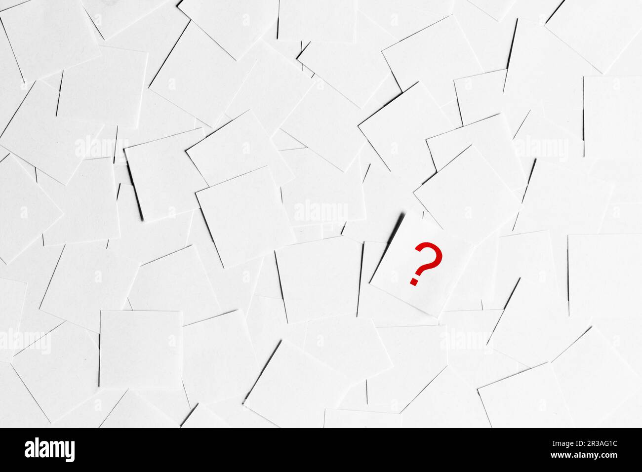 Pile of blank pieces of paper with red question mark in the middle ...