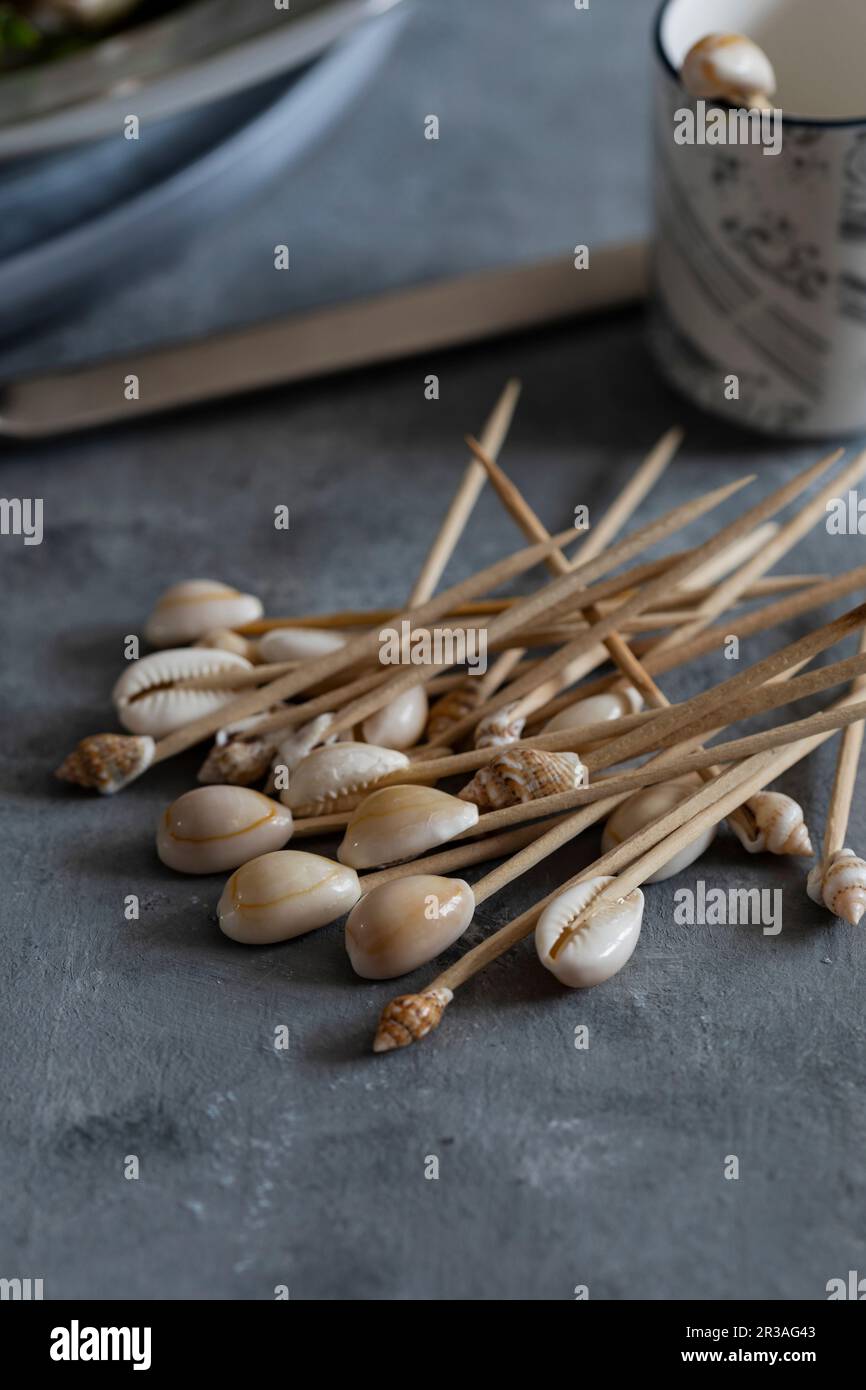 Toothpicks decorated with tiny shells Stock Photo - Alamy