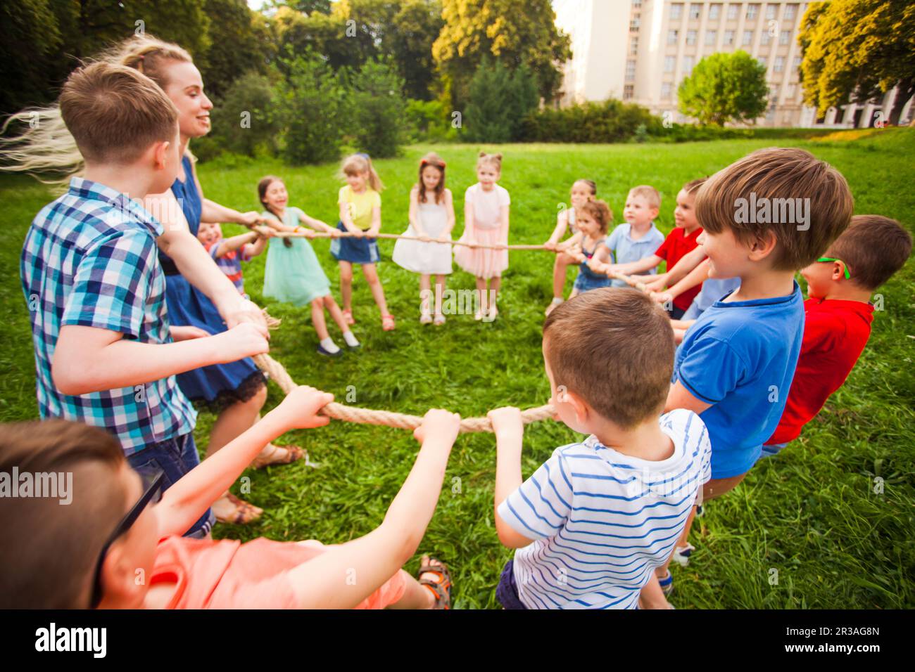 Teacher holds a lesson with children in nature Stock Photo - Alamy