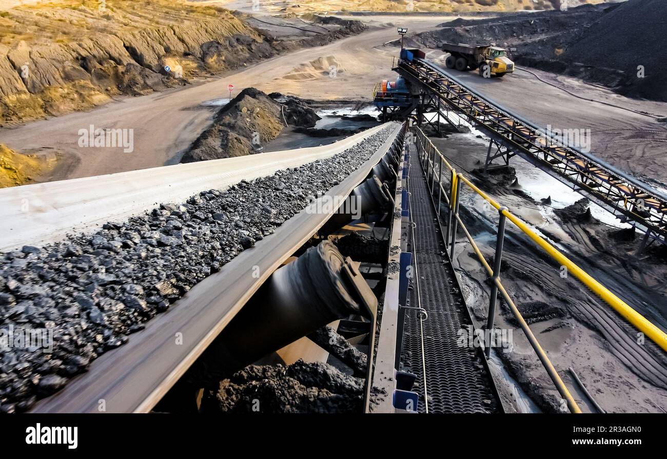 Coal Ore on a conveyor belt for processing Stock Photo - Alamy