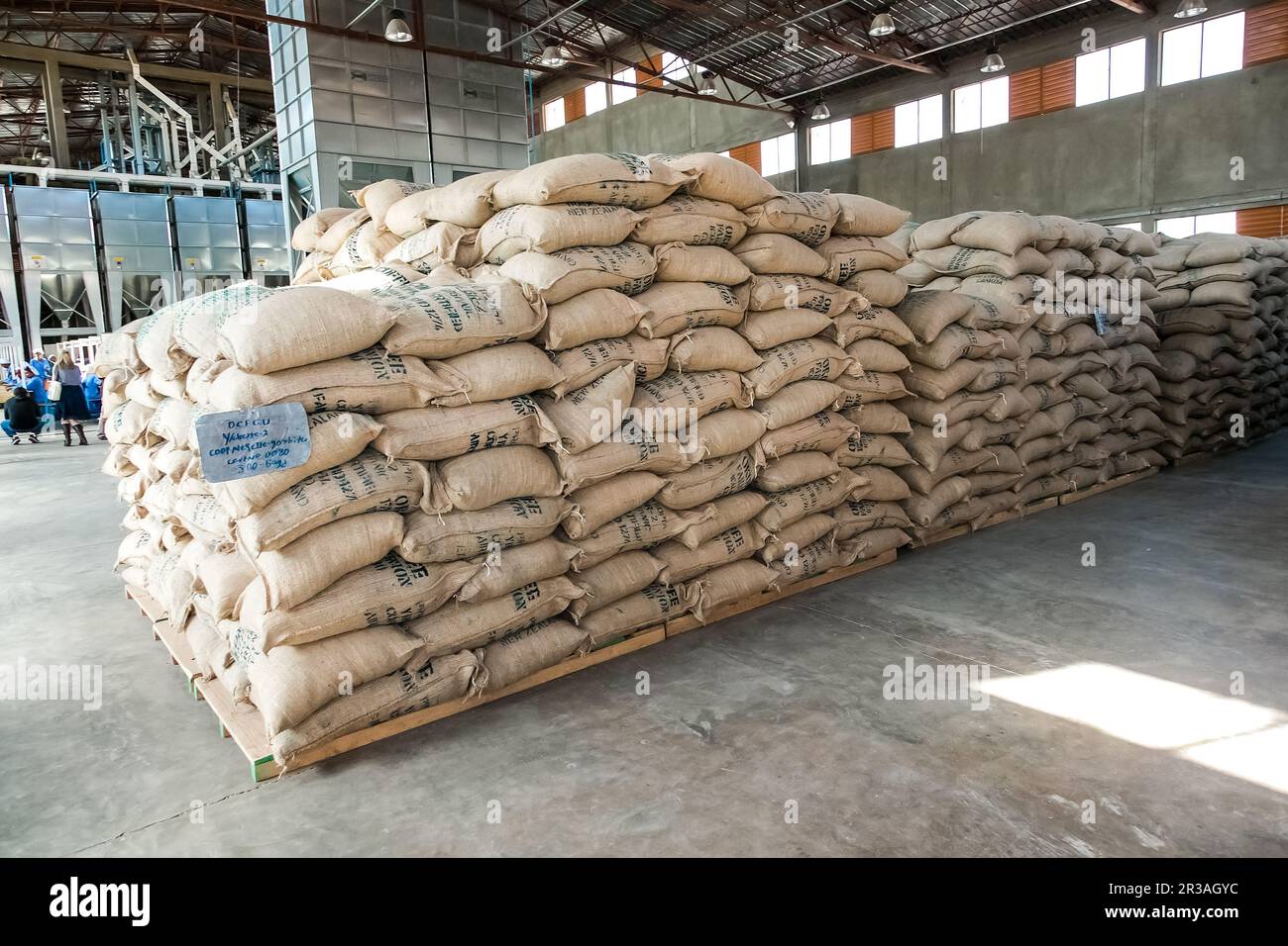 Large bags of coffee beans in a warehouse Stock Photo - Alamy