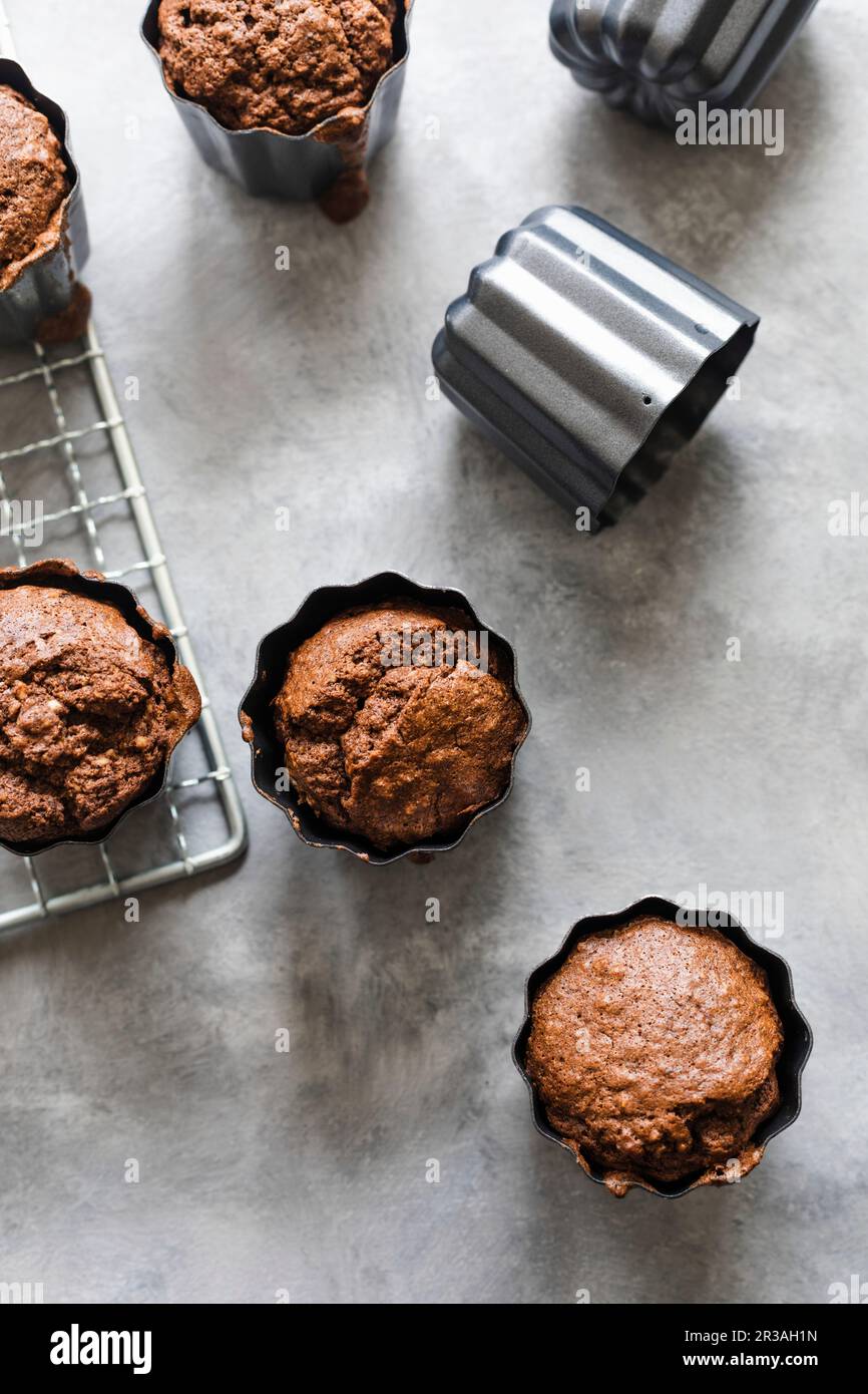 cocoa hazelnut friands baked in canele forms Stock Photo - Alamy