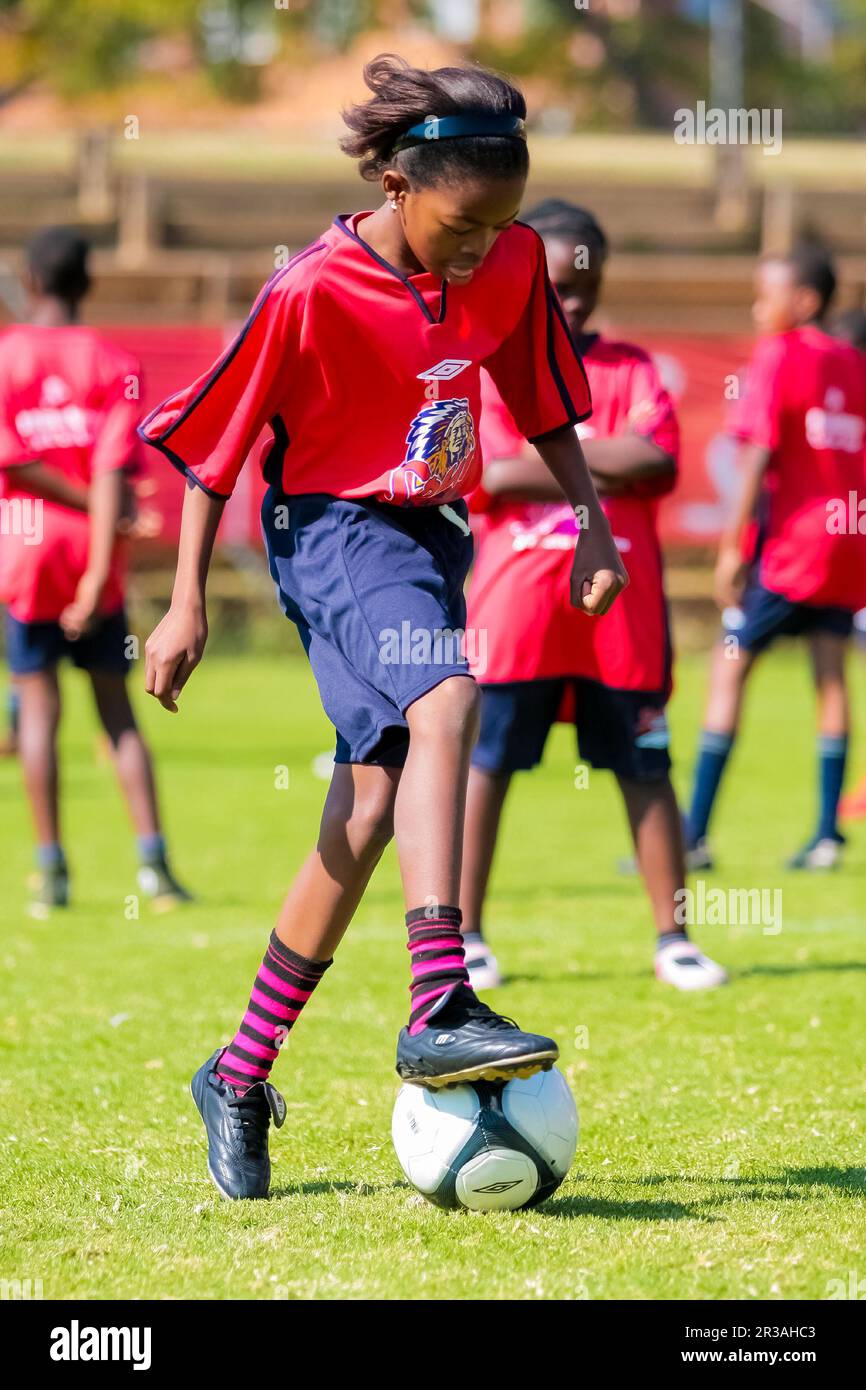 Diverse children playing soccer football at school Stock Photo - Alamy