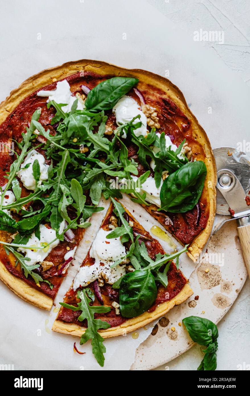Socca pizza with rocket, burrata and chorizo Stock Photo - Alamy
