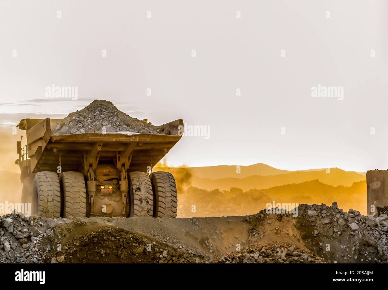 Mining dump trucks transporting Platinum ore for processing Stock Photo ...