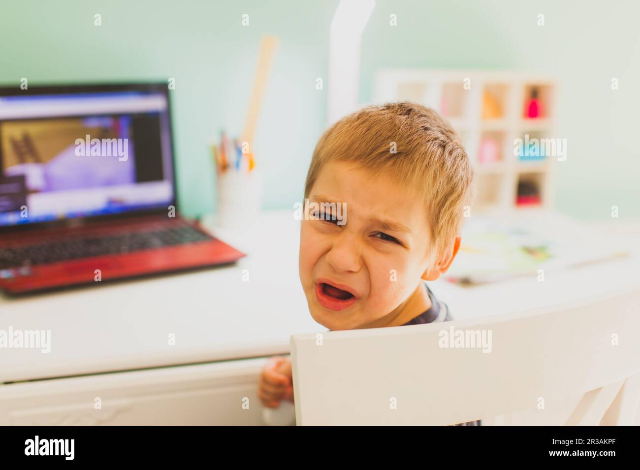 The kid frustrated with challenging online training Stock Photo - Alamy