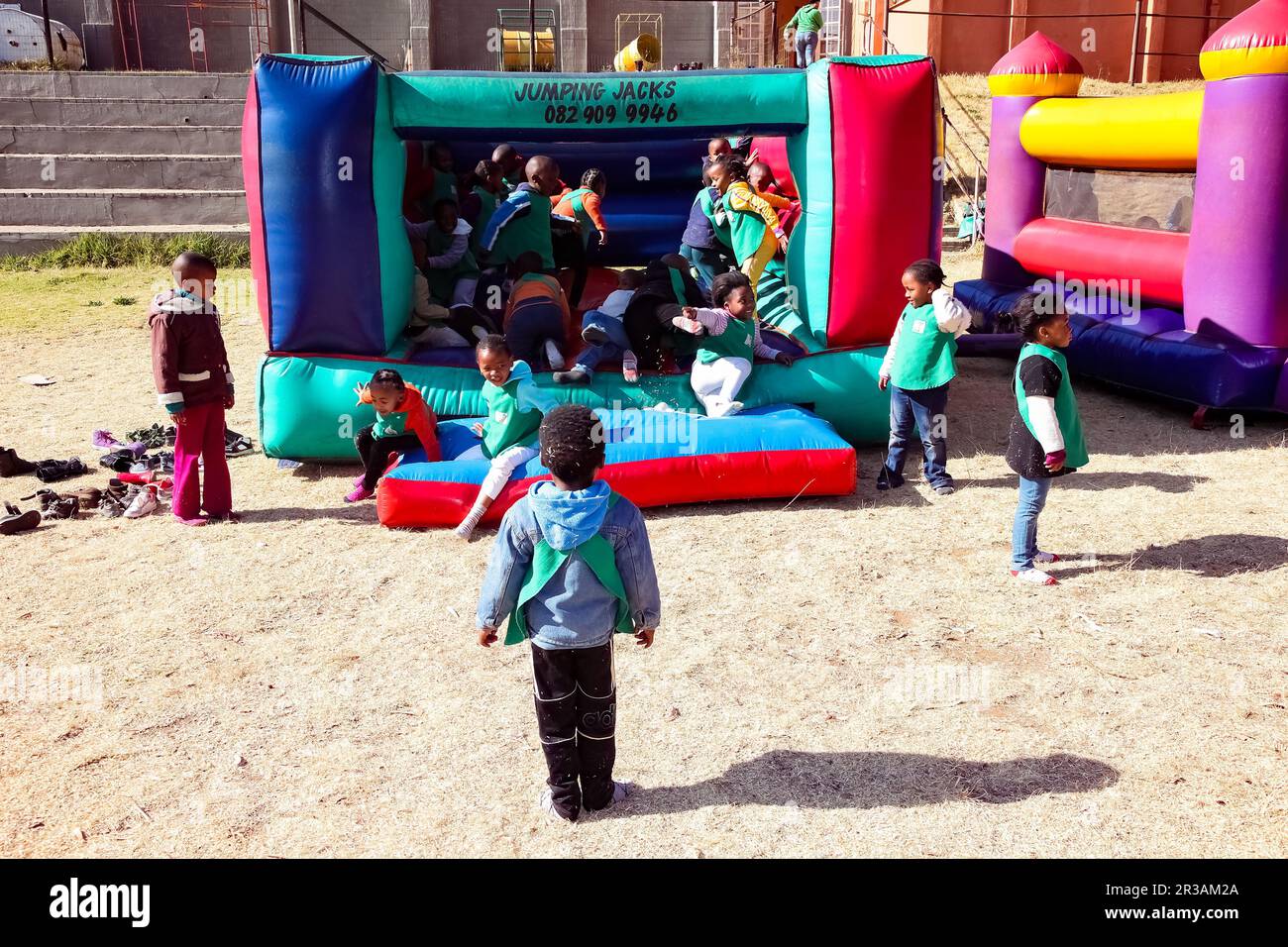 Young African Preschool children having fun on a jumping castle on the ...