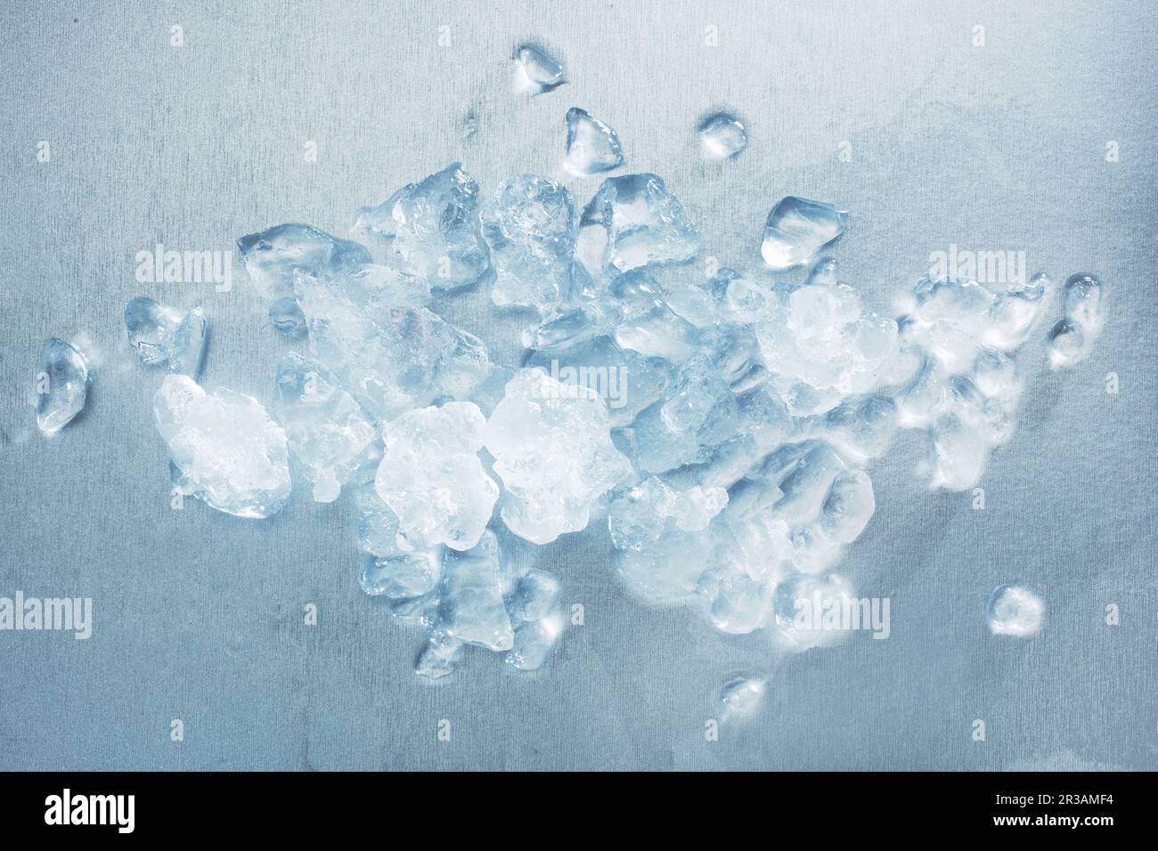 Ice cubes on a grey background Stock Photo - Alamy