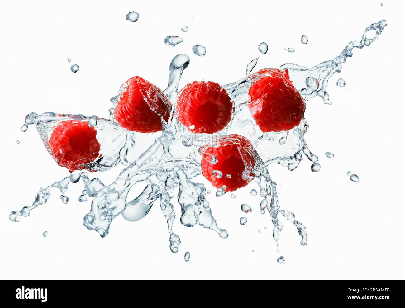 Raspberries with a splash of water Stock Photo - Alamy