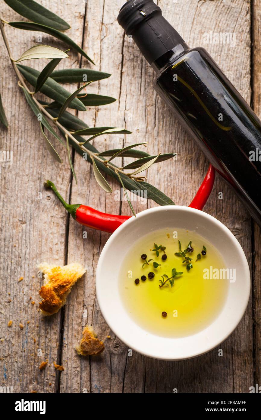 Olive oil with spices Stock Photo - Alamy