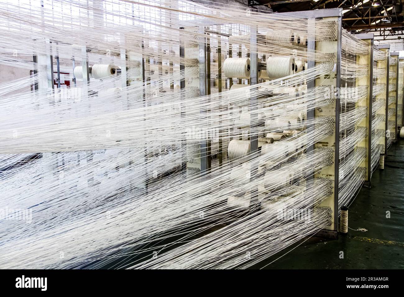Cotton Thread lines for a copwinder weft assembly line loom Stock Photo ...