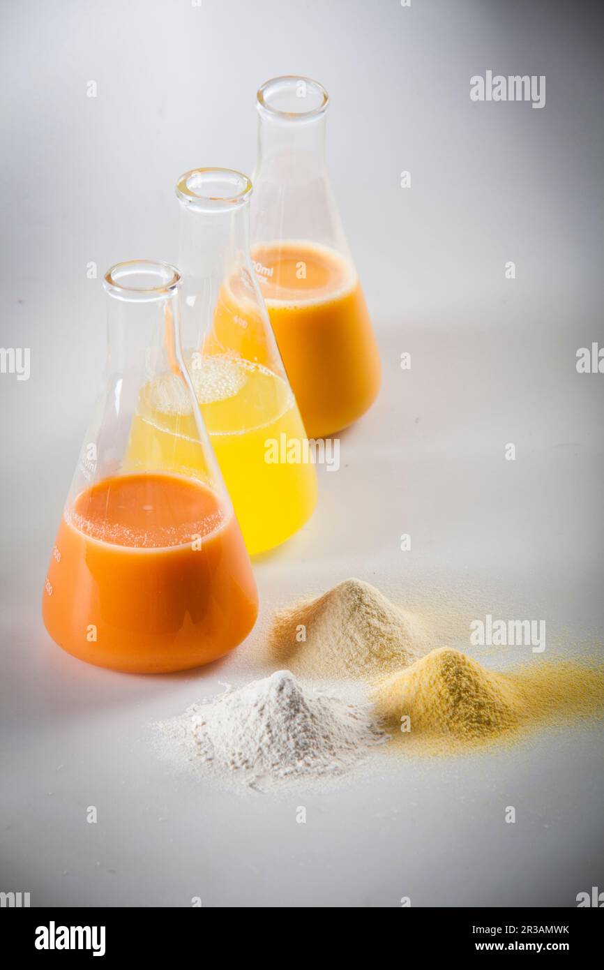 Chemistry bottle of juices and pyramids of food ingredients Stock Photo ...