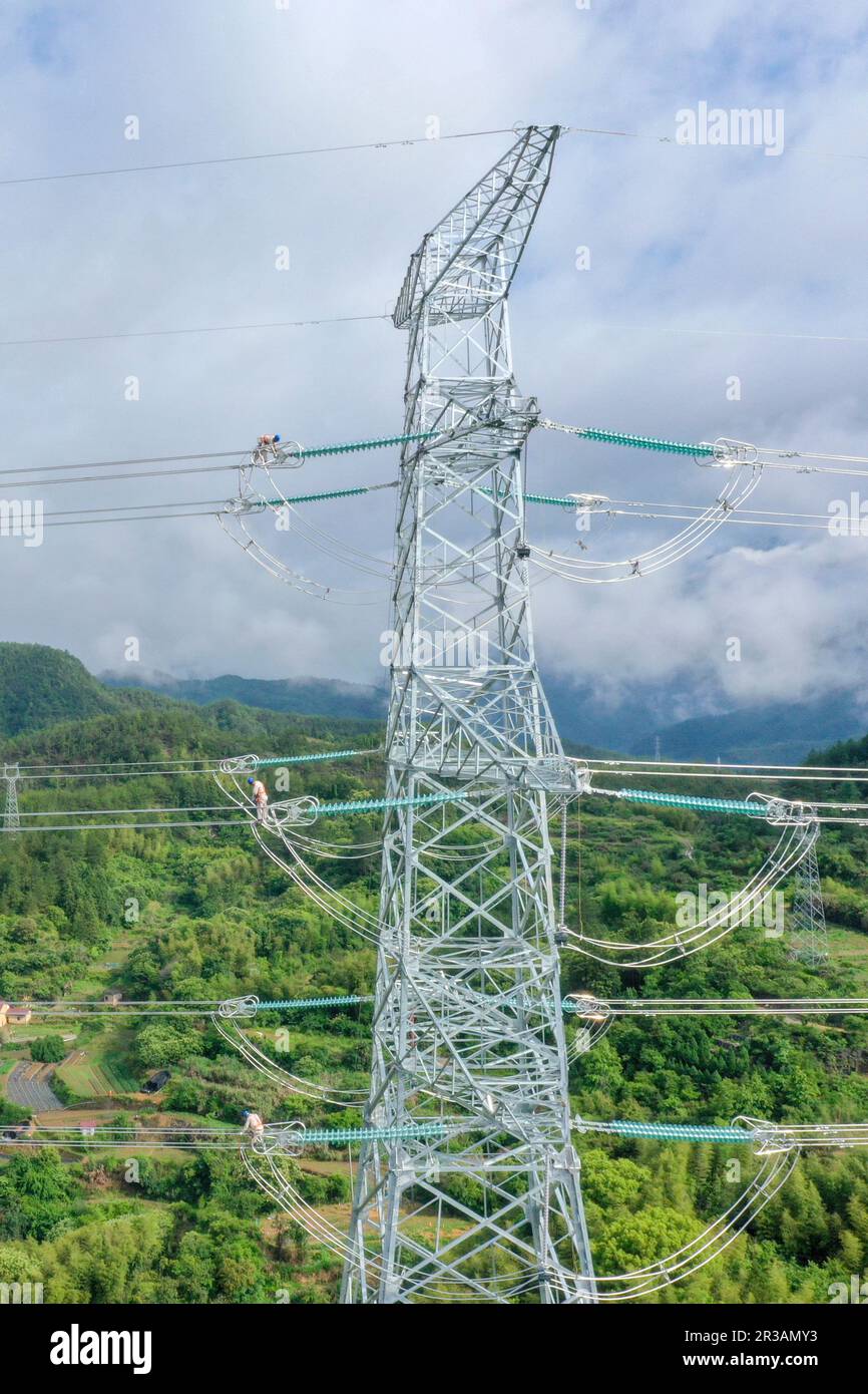 LISHUI, CHINA - MAY 23, 2023 - Workers check a power line deep in a ...