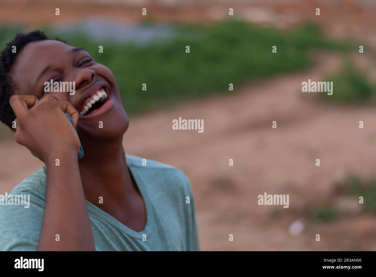African man celebrating using smartphone hi-res stock photography and ...