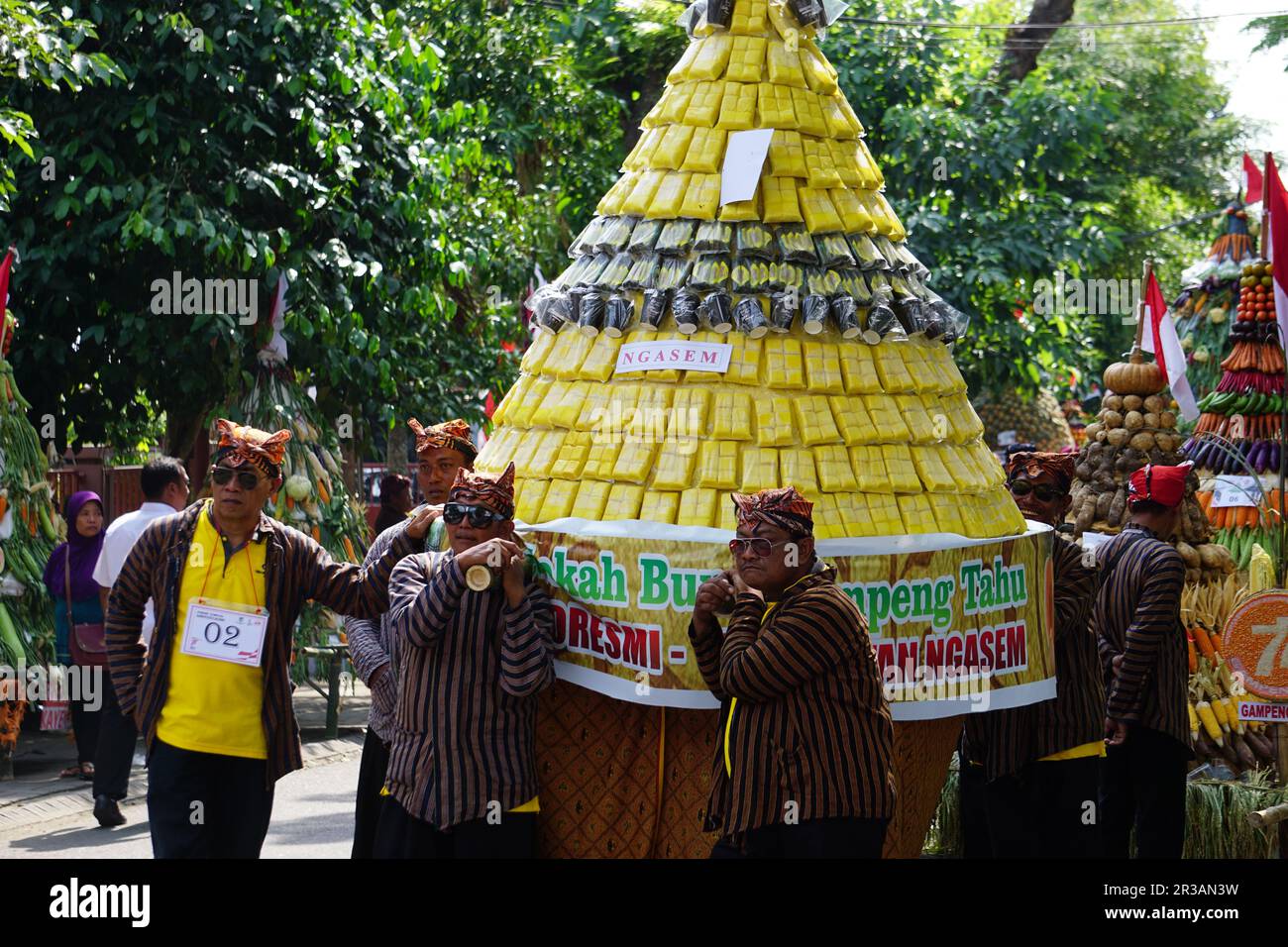 Yellow tofu (tahu takwa) on Kirab tumpeng hasil bumi (farmer ...