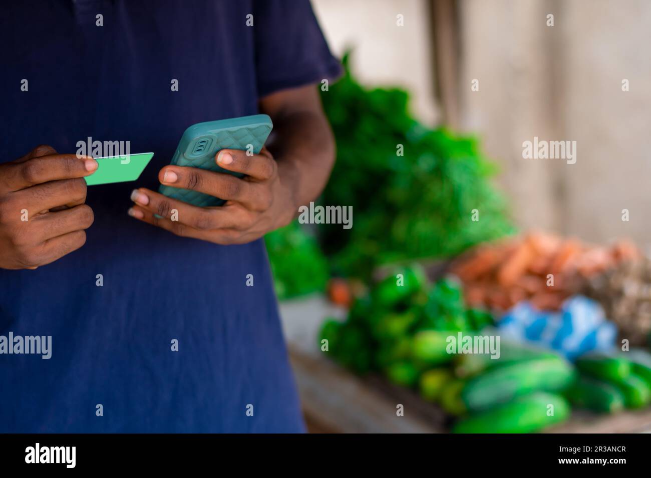 copy space image of a young african male trader holding a credit card ...