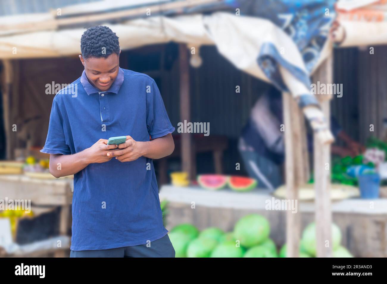 copy space image of Young black man using his mobile phone, isolated in ...