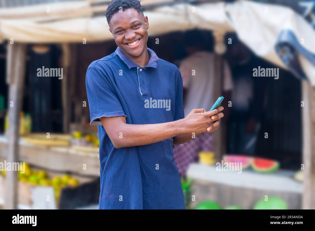 copy space image of Young black man using his mobile phone, isolated in ...
