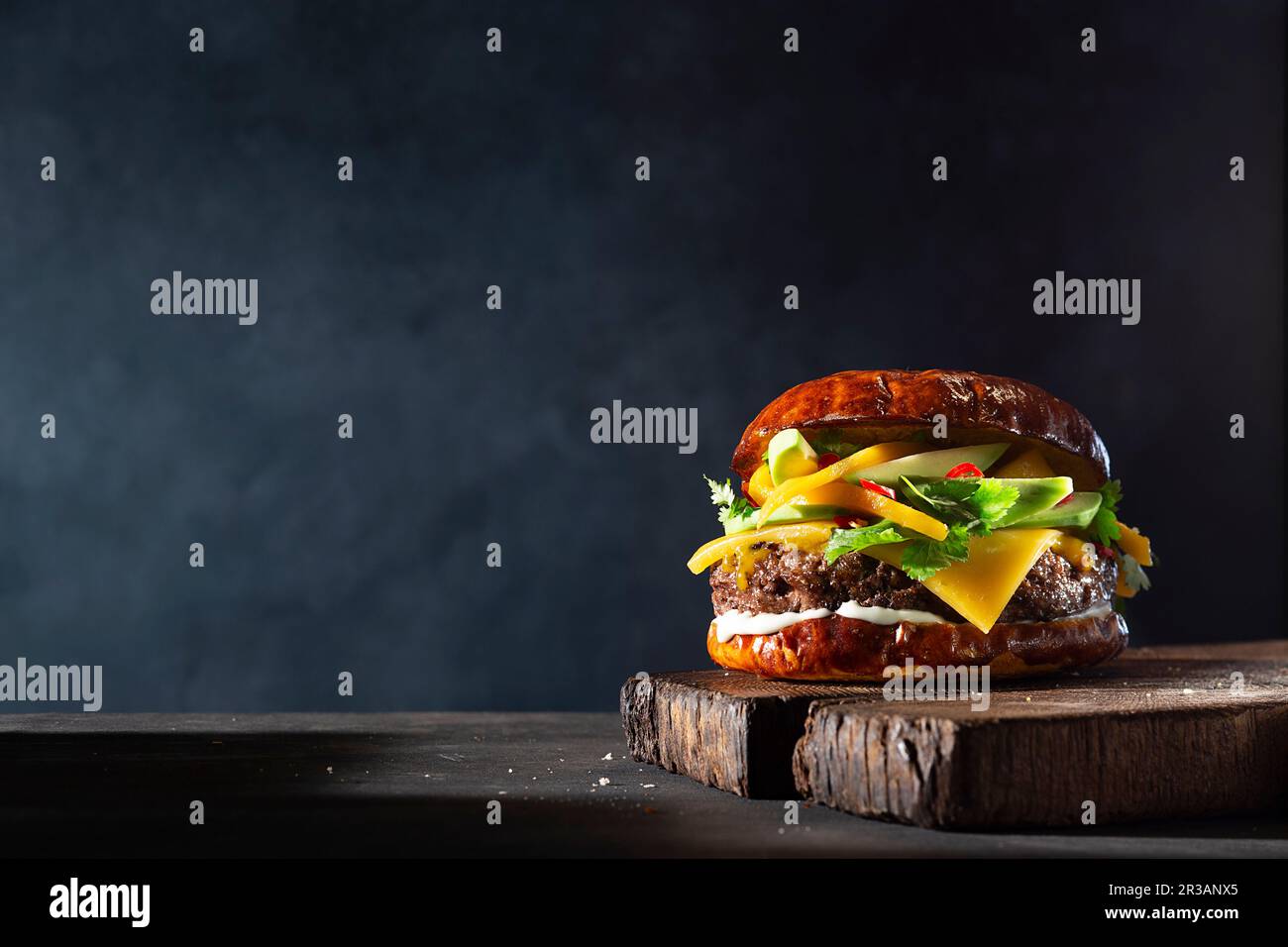 Burger with mango and avocado Stock Photo - Alamy